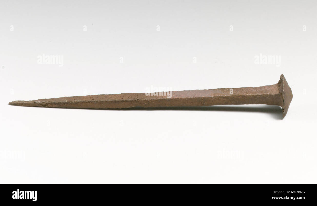 A metal nail from antiquity, likely used in construction or as a ...