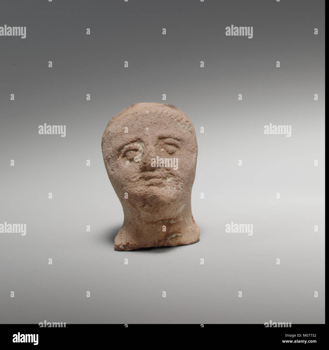 This is a classical representation of a male head, showcasing the ...