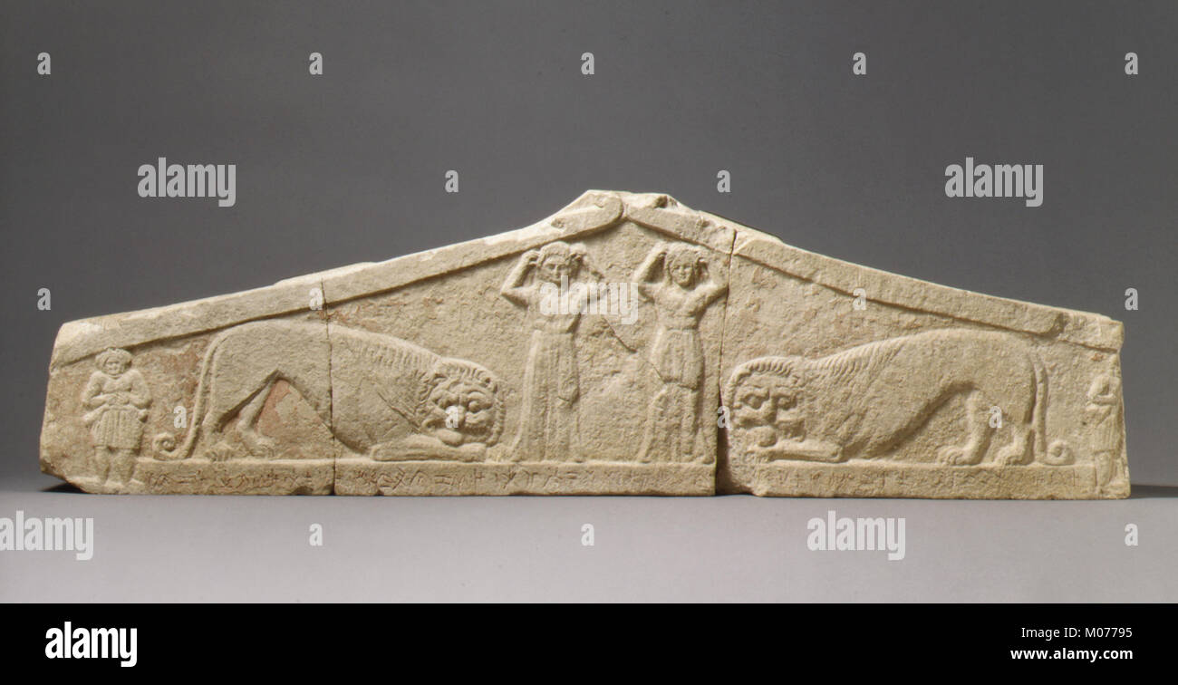 This limestone pediment from a funerary stele contains commemorative ...