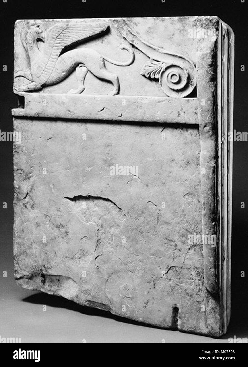 This marble table leg, a trapezophoros, features reliefs of griffins ...
