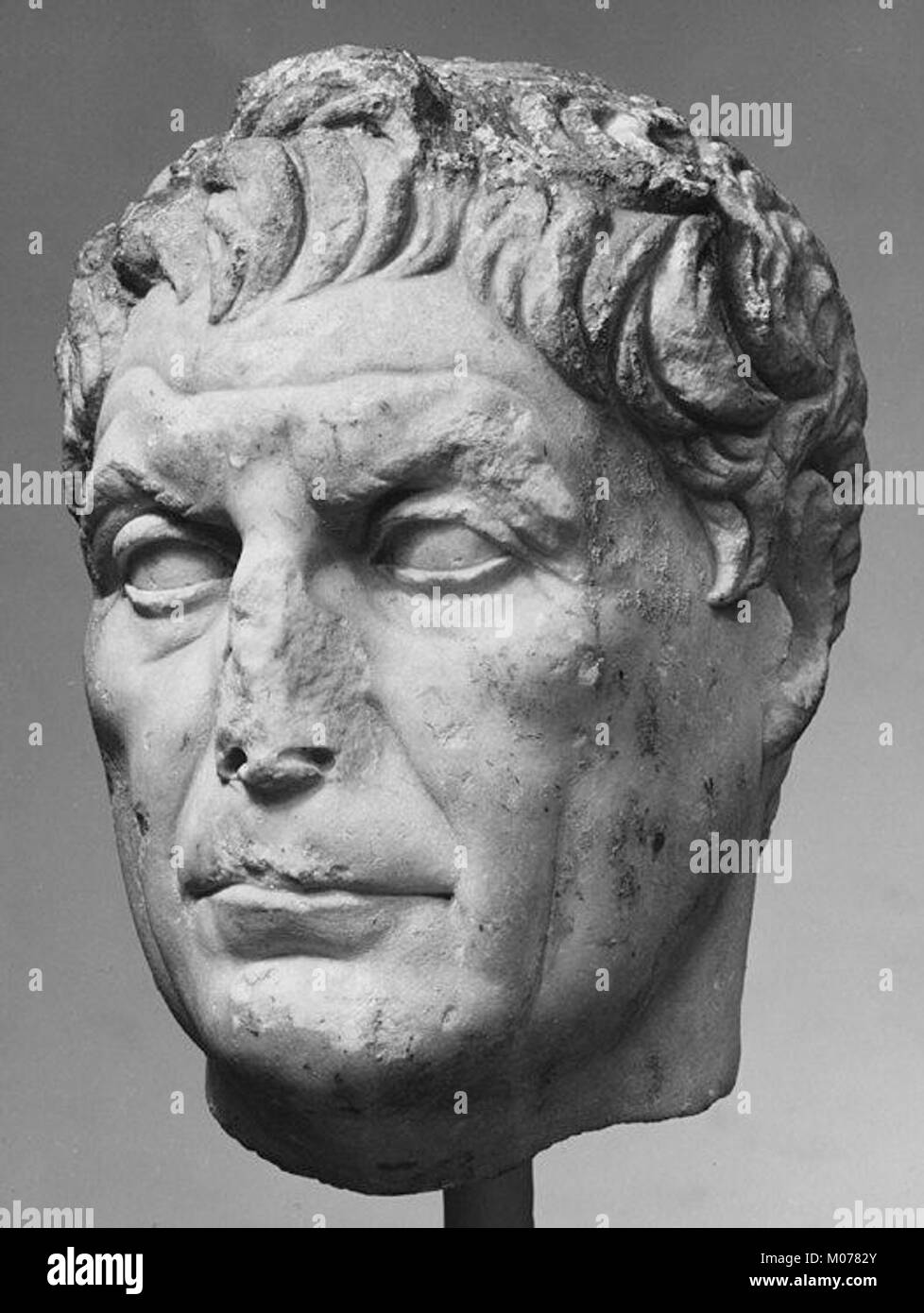 This marble portrait of a man, likely from ancient Rome, presents a ...