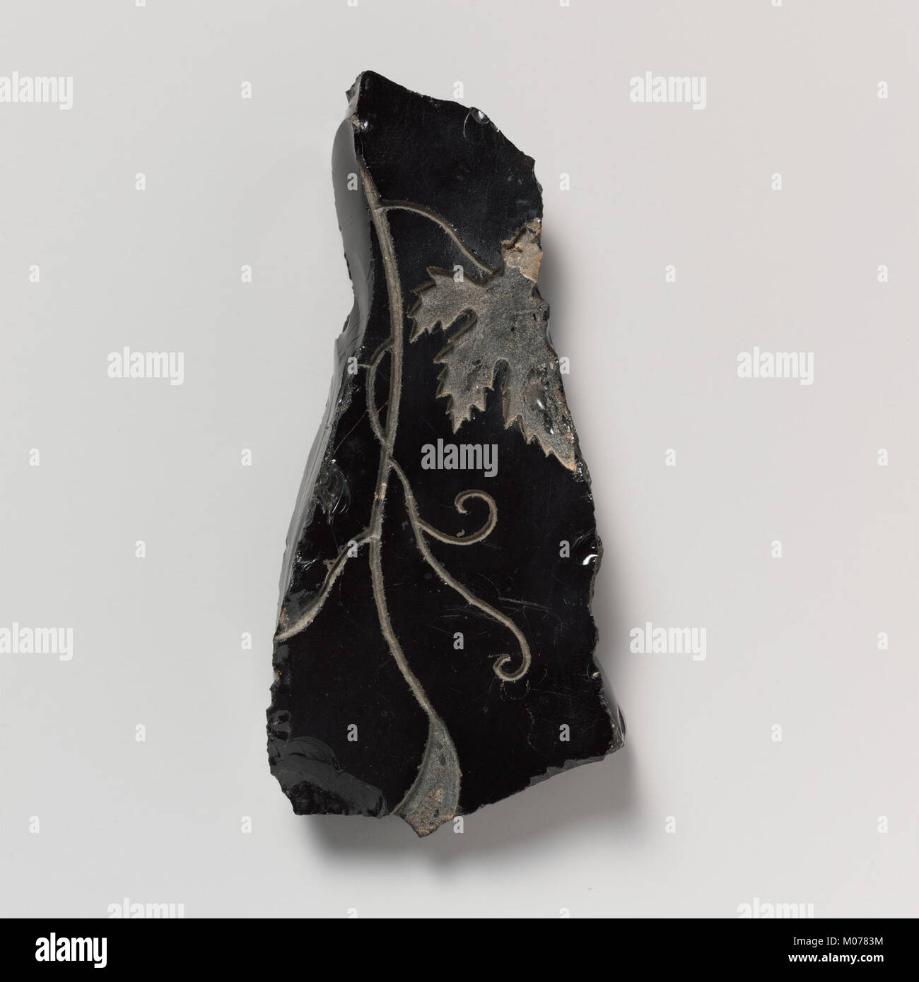 This fragment of an obsidian revetment slab provides insight into ...