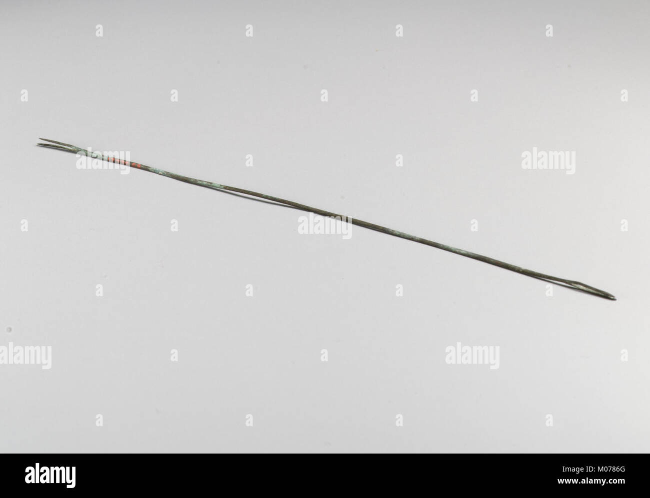 This needle, used in netting techniques, highlights the craftsmanship ...