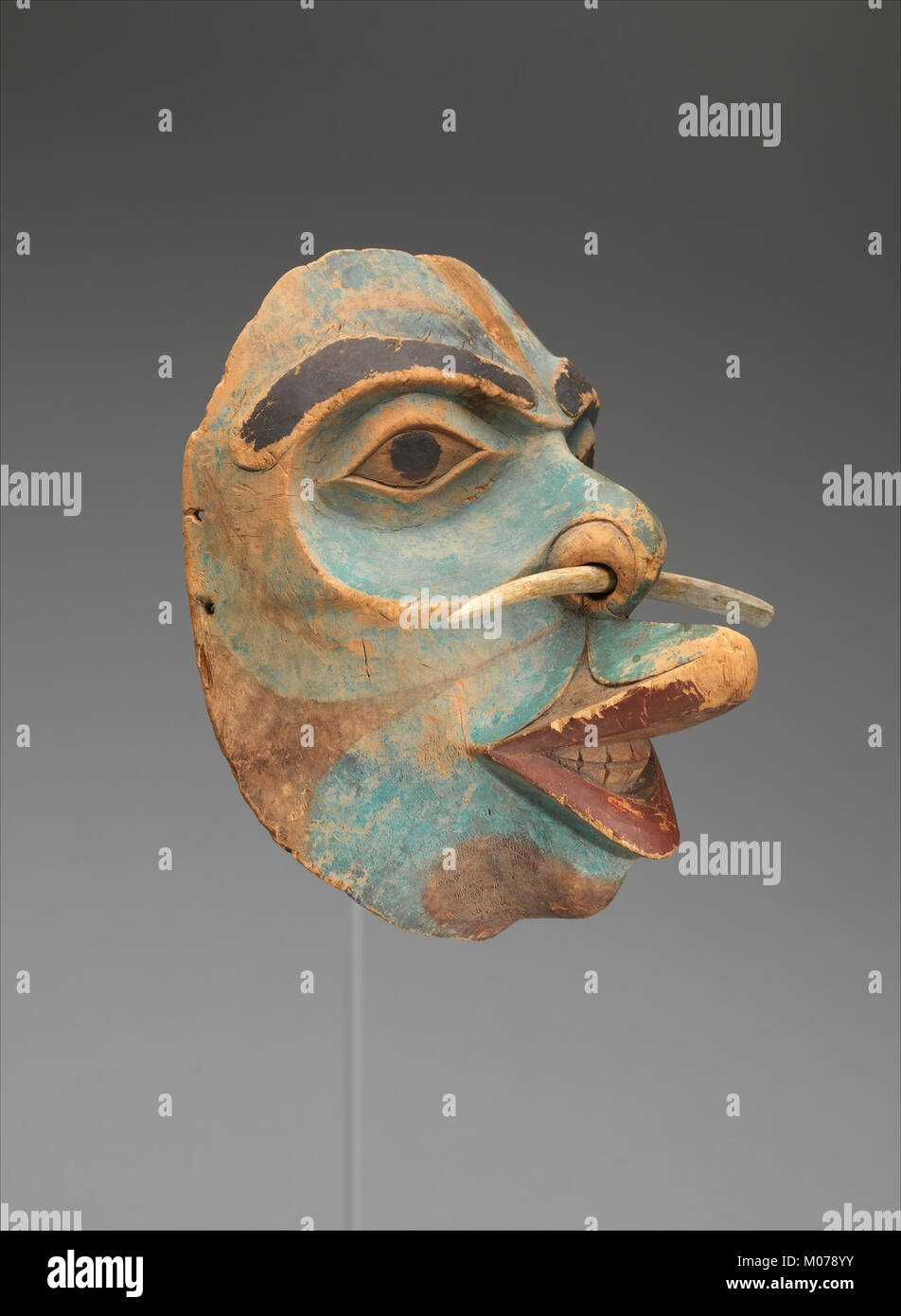 This mask, part of the MET collection, is a representation of a face ...