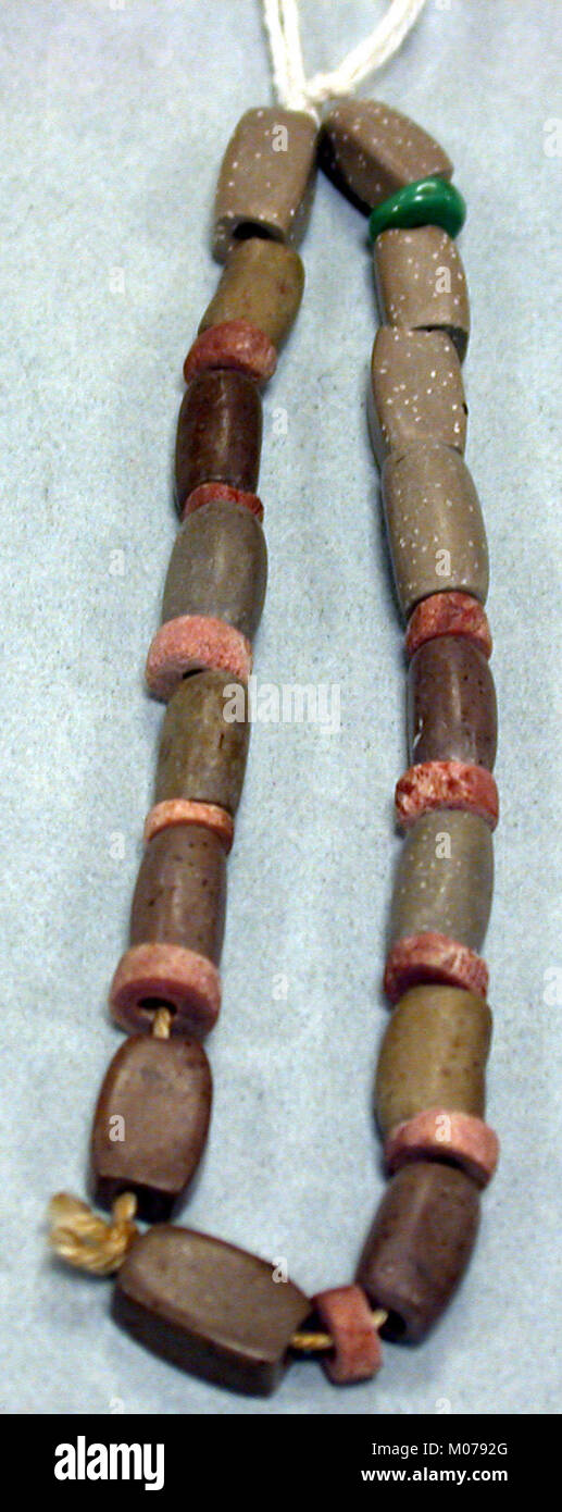 This necklace, made of stone and shell beads, reflects ancient beading ...