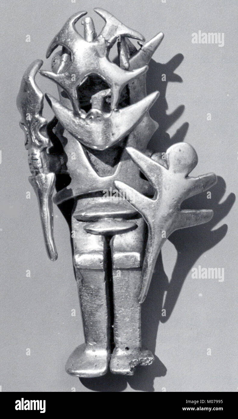 This pendant features a masked figure, showcasing intricate design and ...