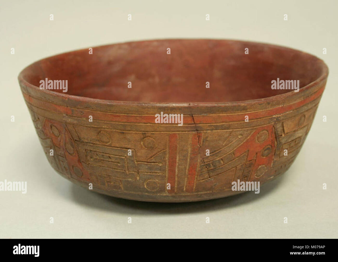 This incised painted bowl features intricate decoration, combining ...