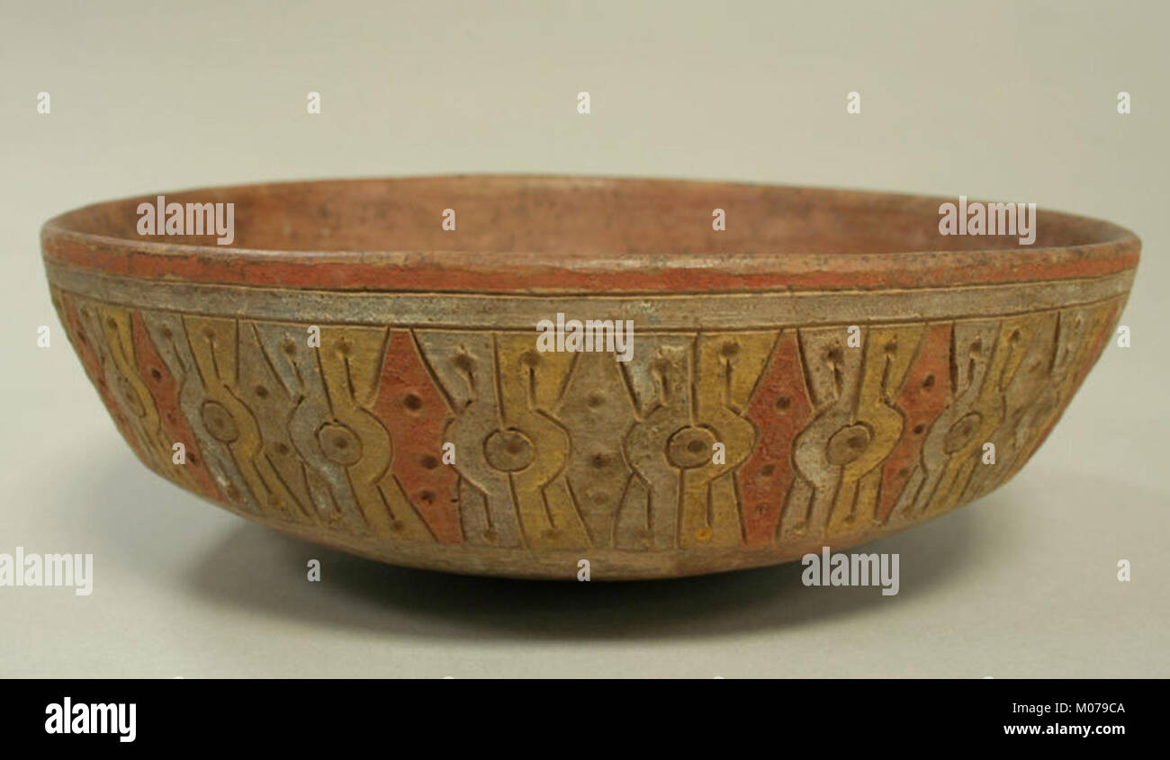 A painted bowl with incised designs, illustrating the detailed artistry ...