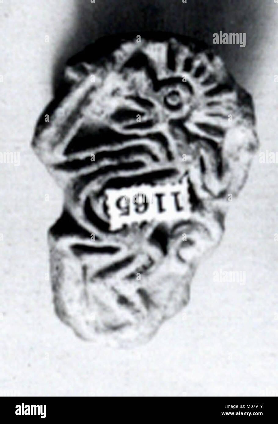 This monkey-shaped stamp, likely used for imprinting, features the ...