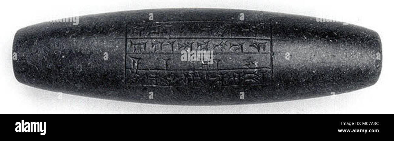 This inscribed weight, likely used in trade or measurement, features ...