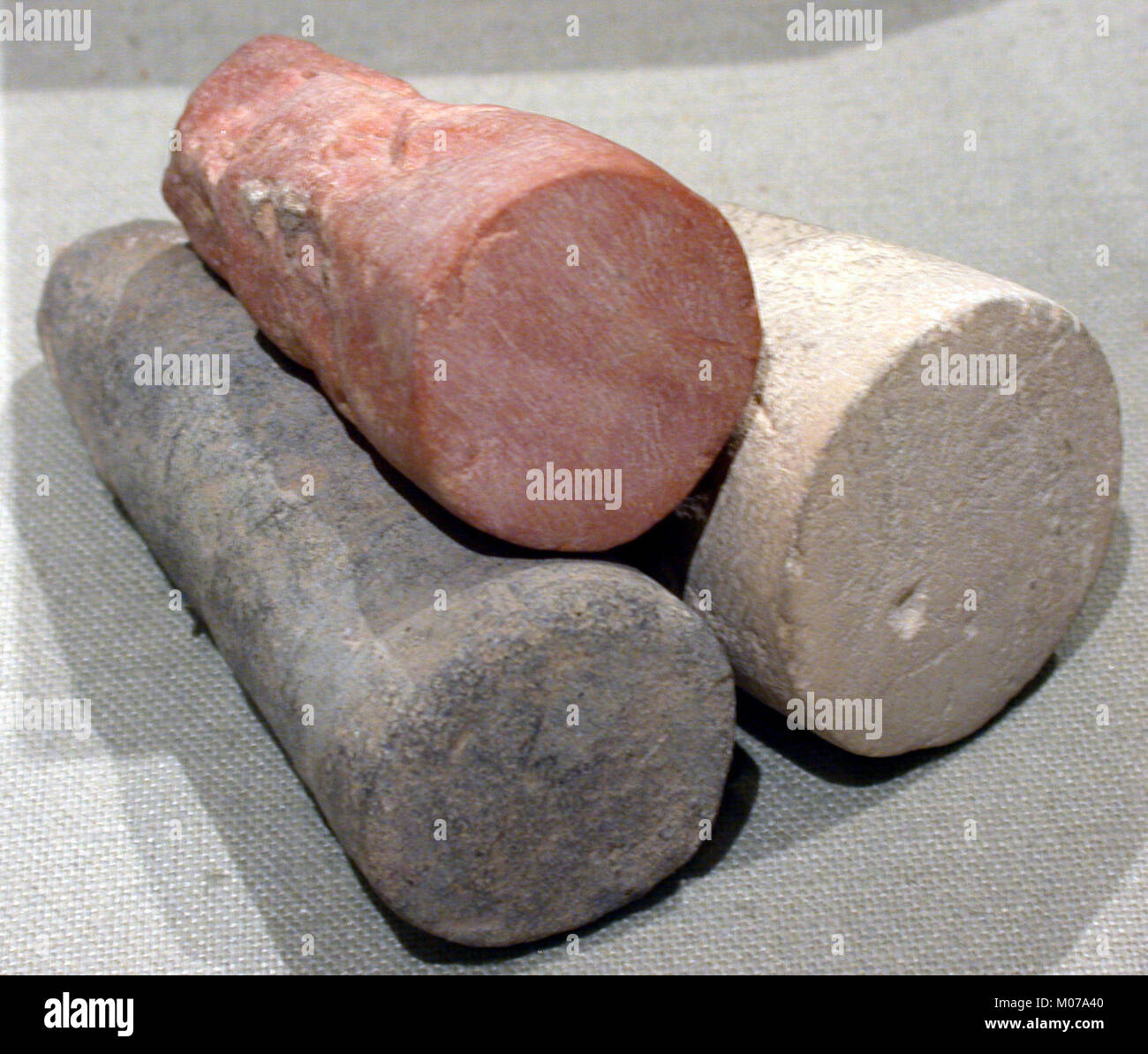 This mosaic cone is an example of ancient decorative art, likely used ...