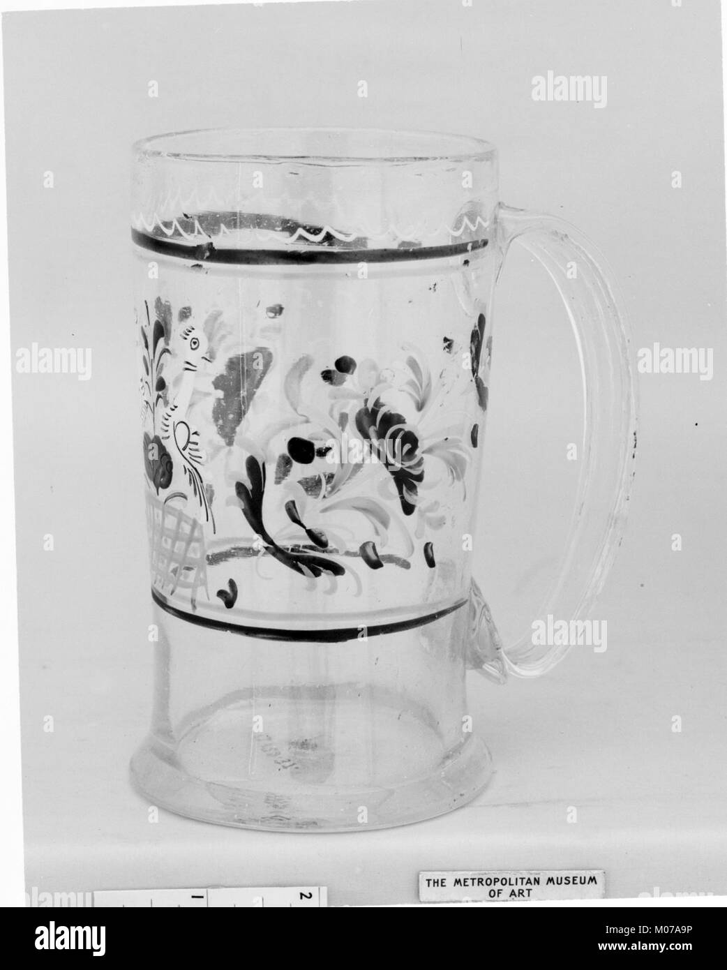This mug, crafted from ceramic, displays a simple yet functional design ...
