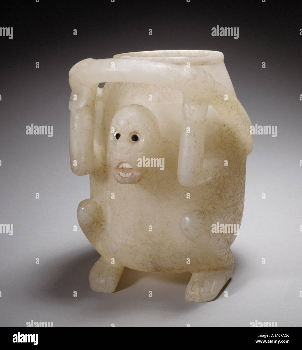 This monkey-shaped vessel is an example of ancient craftsmanship. Its ...