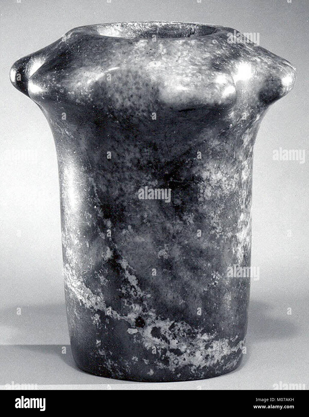 This ancient mace head, a type of weaponry from the prehistoric period ...