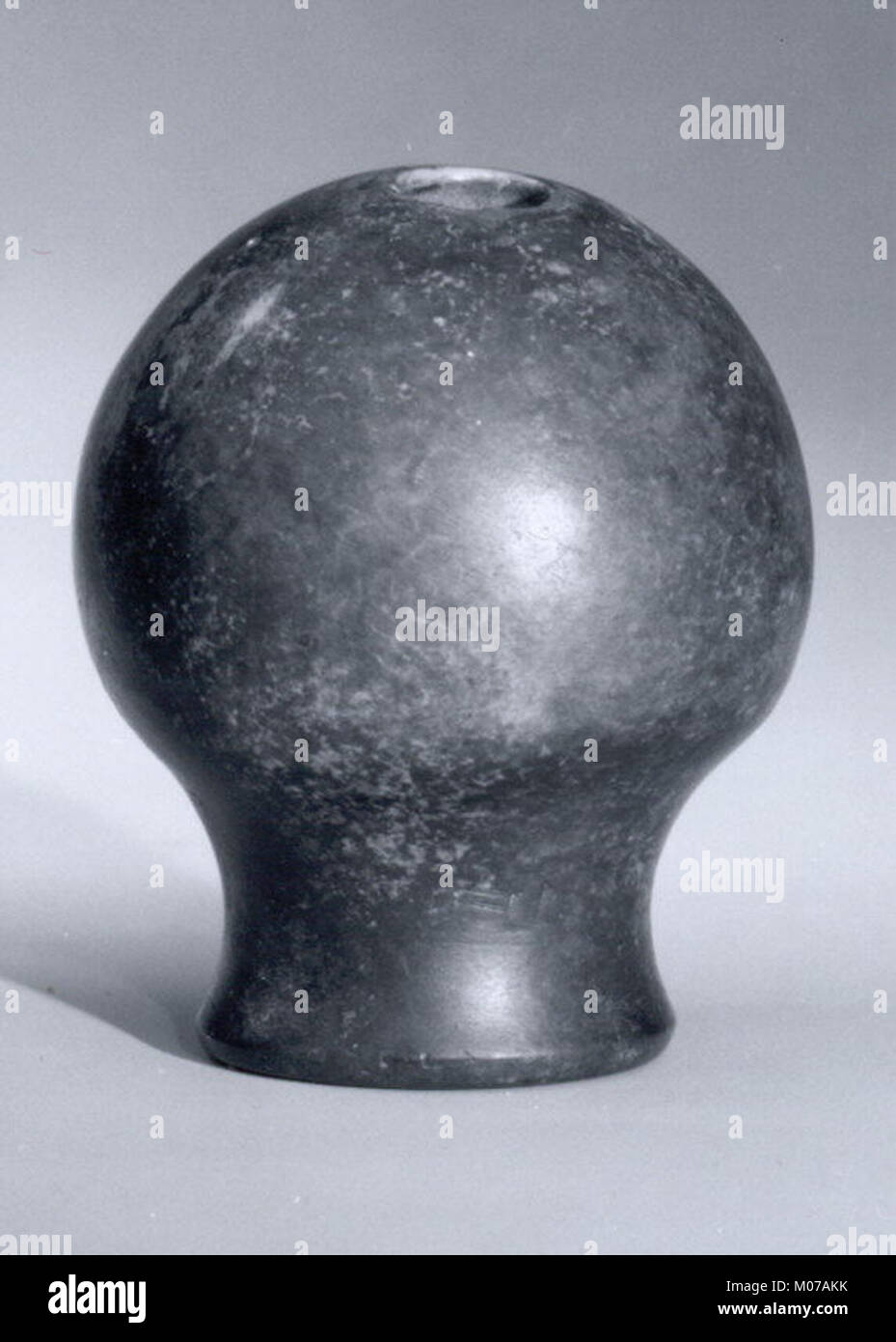 A mace head, made of stone or metal, used as a weapon or ceremonial ...