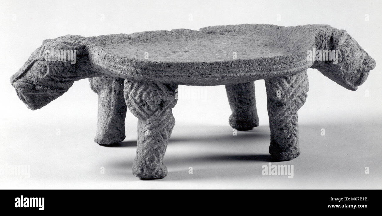 A metate, a traditional grinding stone used in ancient and modern food ...