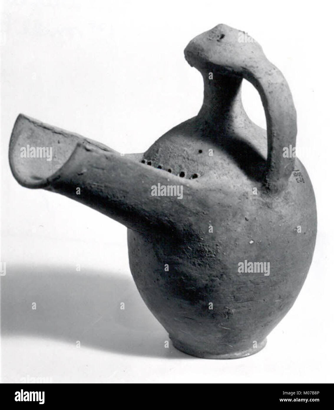 This jug, featuring a built-in strainer, showcases practical design and ...