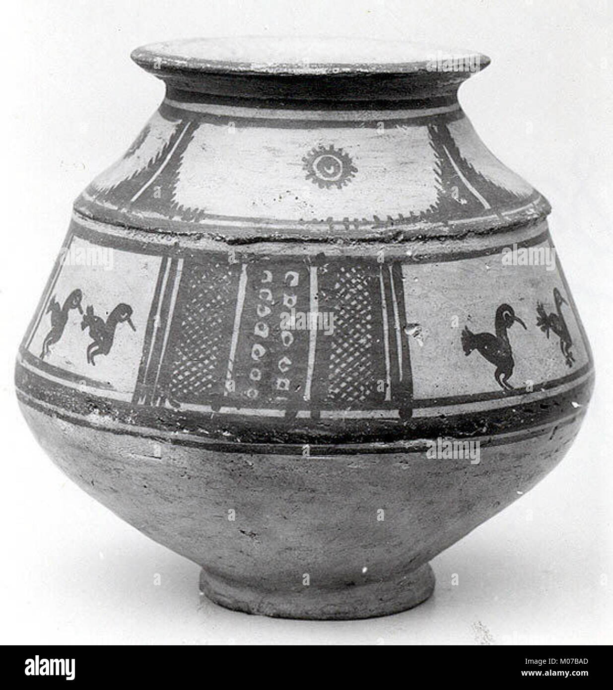 This jar features decorative panels with paired birds, showcasing the ...