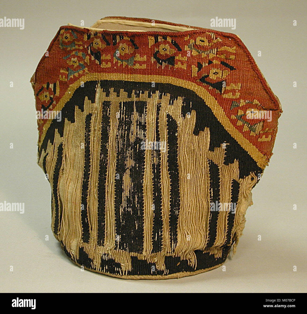 The Mitre-shaped cap is a traditional ecclesiastical headpiece ...