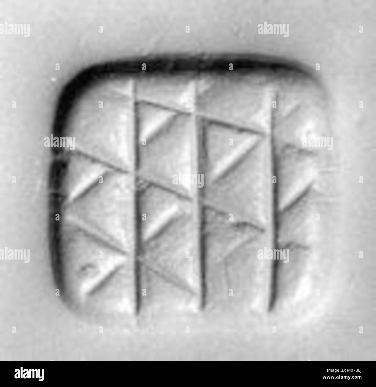 This rectangular seal with a loop handle is a significant historical ...