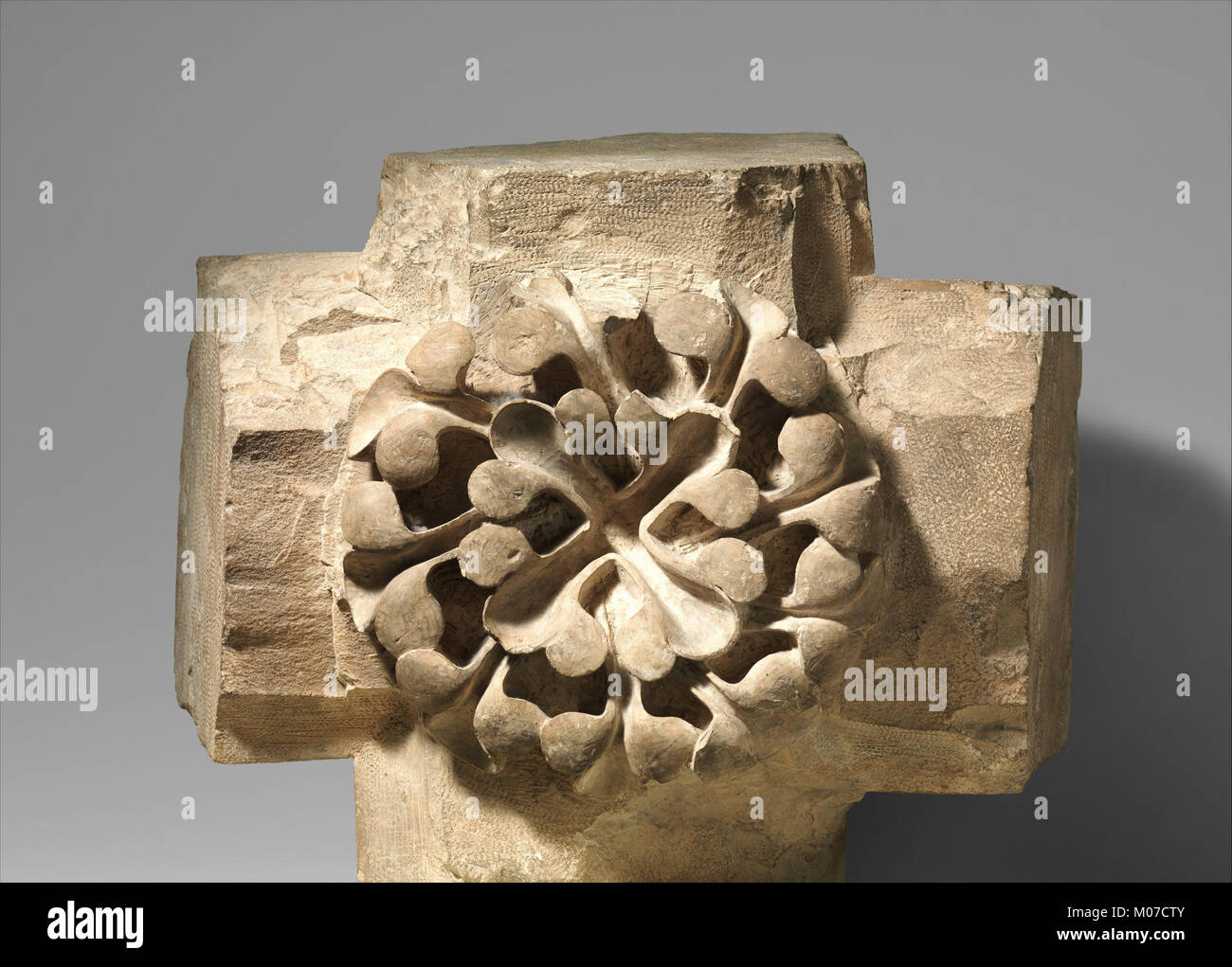 This keystone, originating from a vaulted ceiling, serves as an ...