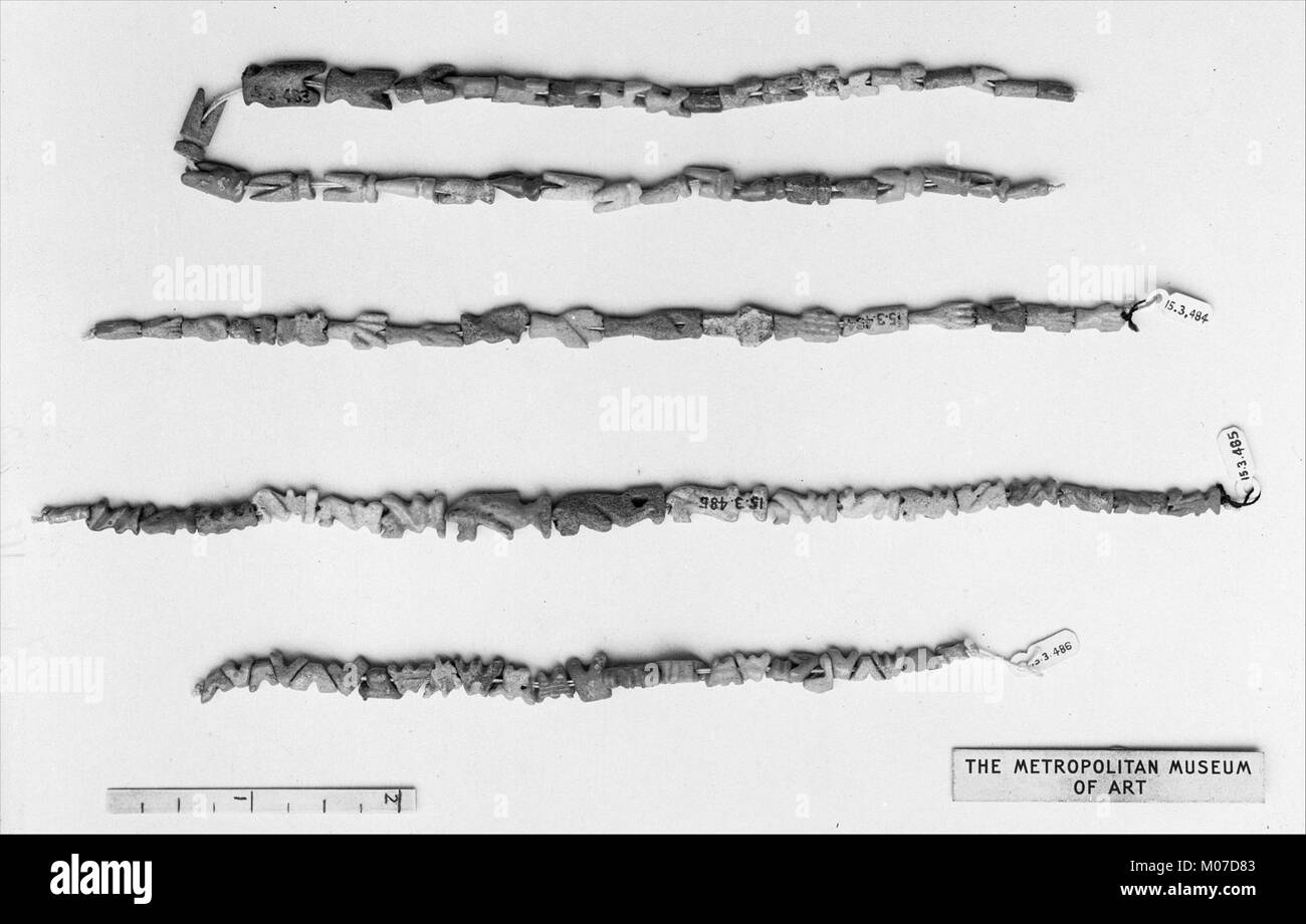 This necklace features a collection of amulets, used historically for ...