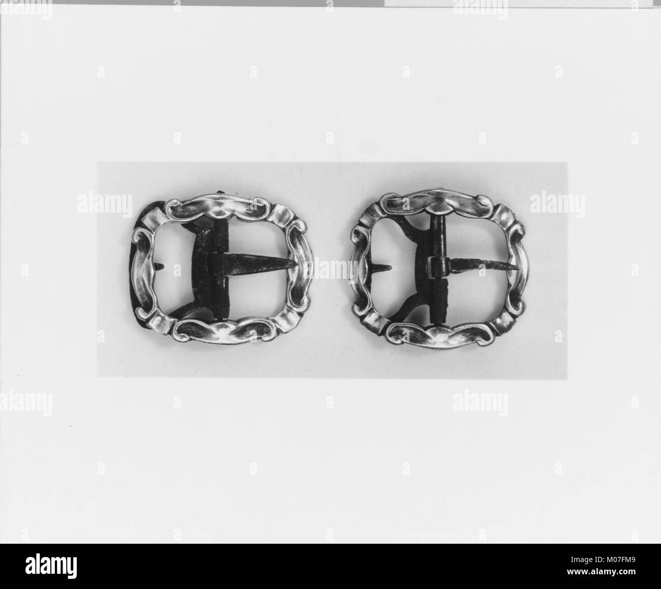 This metal knee buckle was used as a decorative and functional ...