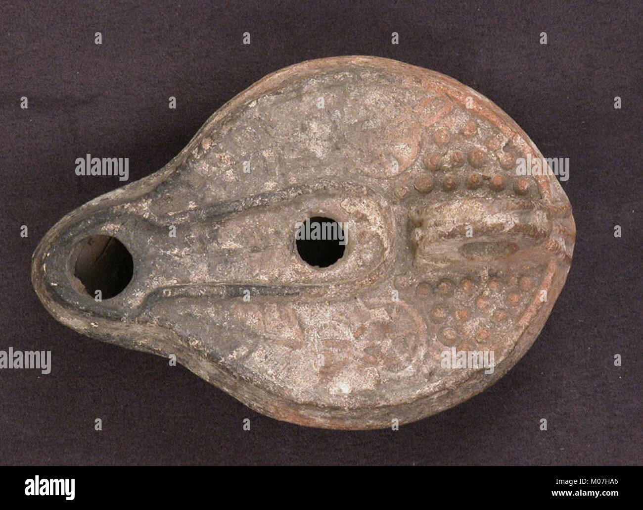 This antique lamp showcases period design typical of its era, combining ...