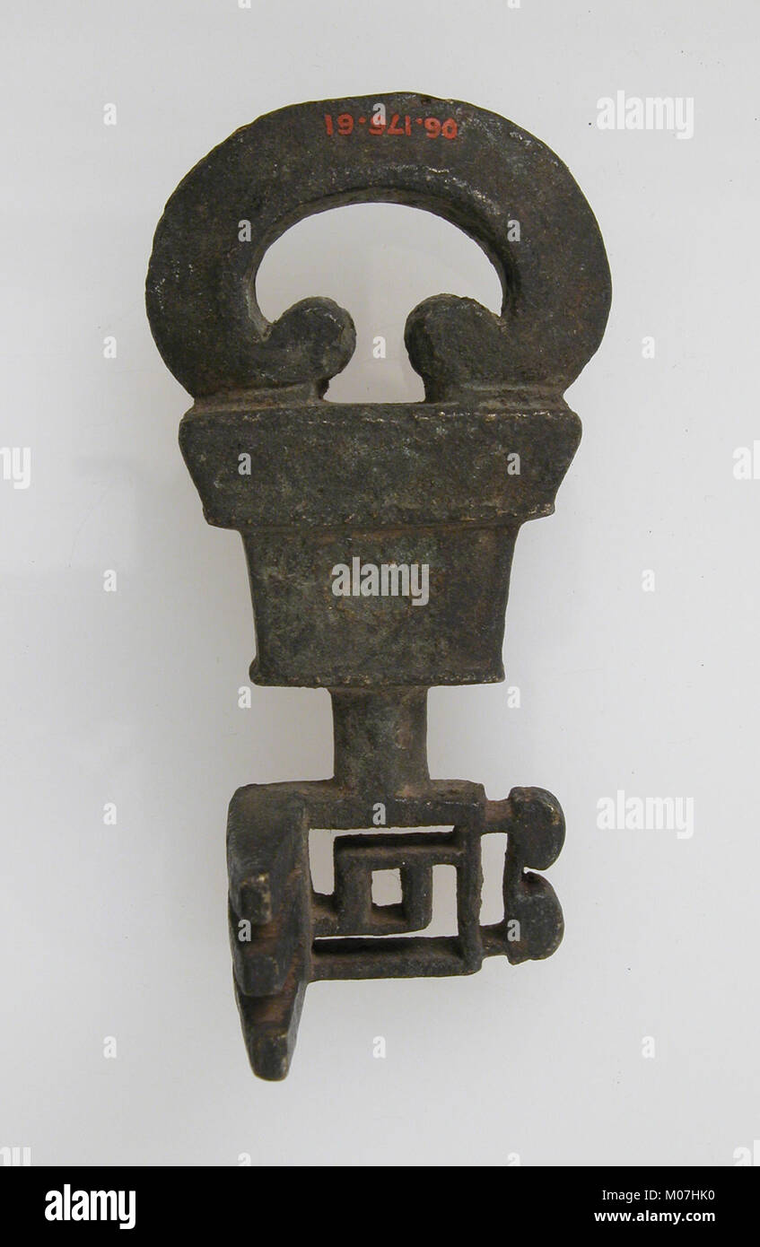 This key, an ancient functional object, symbolizes access and control ...