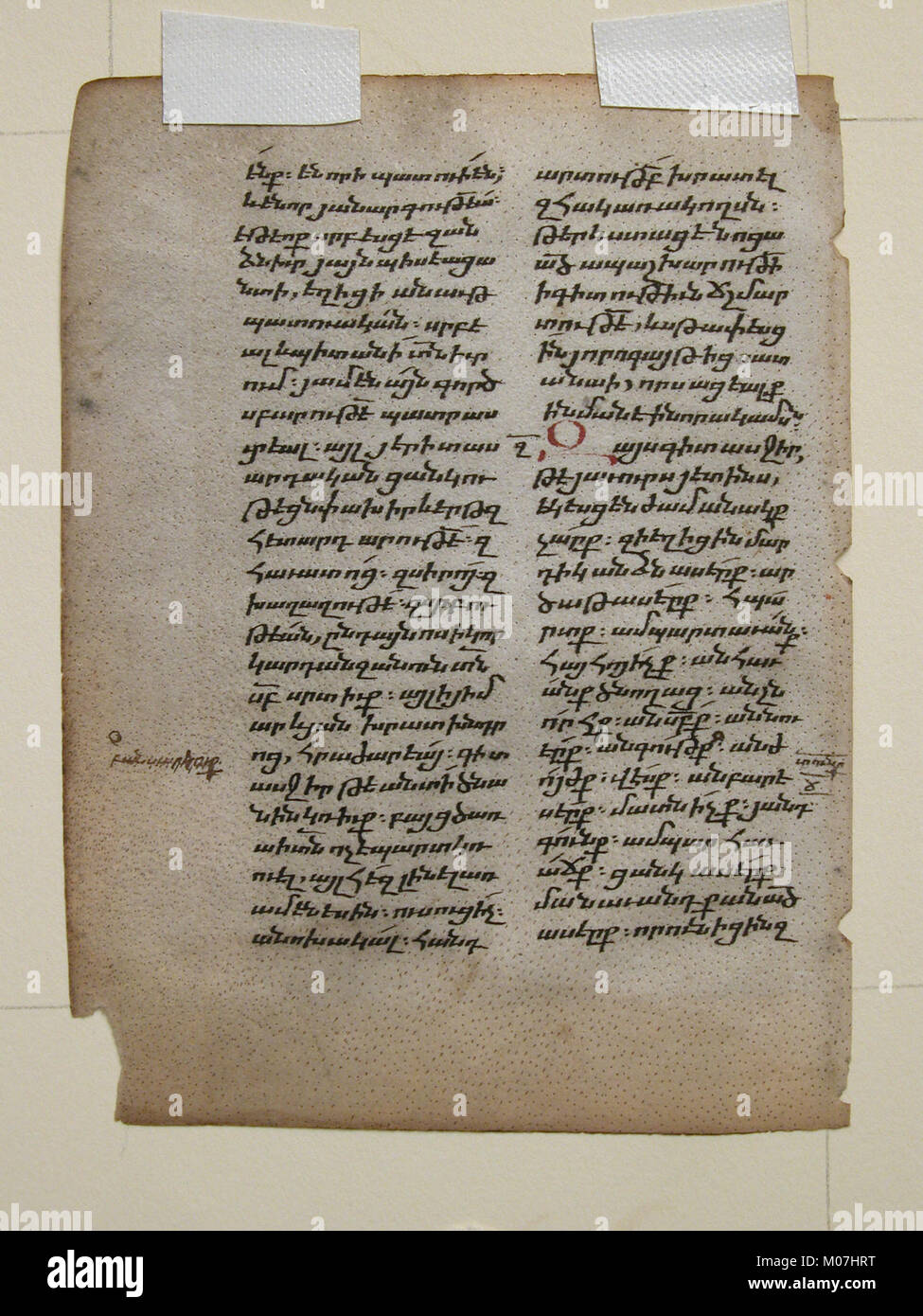 A manuscript leaf featuring text in Bolorgir, an ancient script. The ...