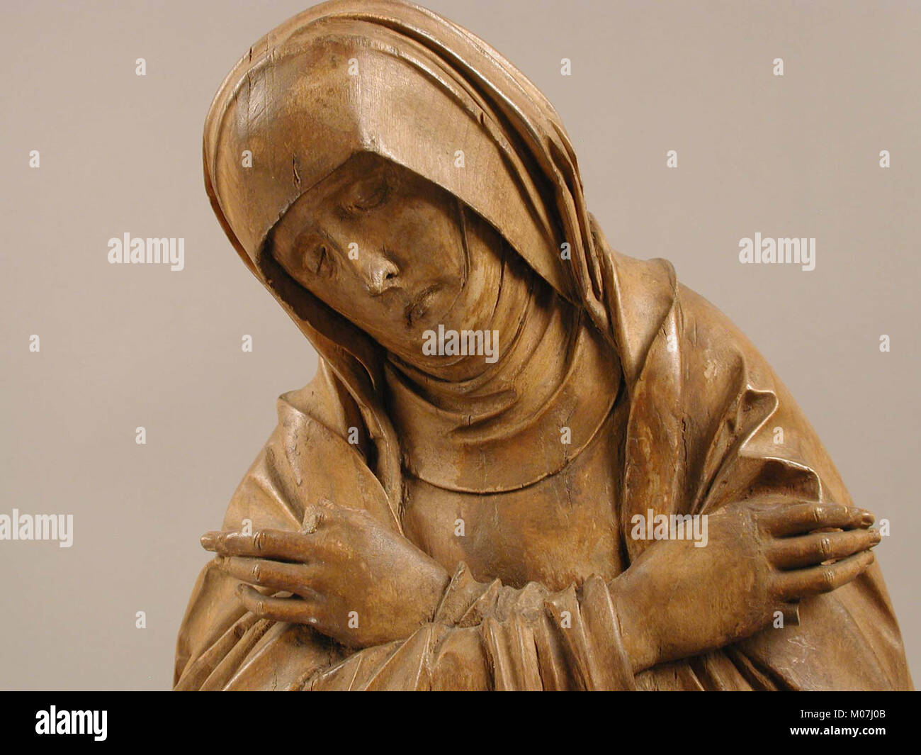 This artwork depicts the Virgin Mary in a mourning state, highlighting ...