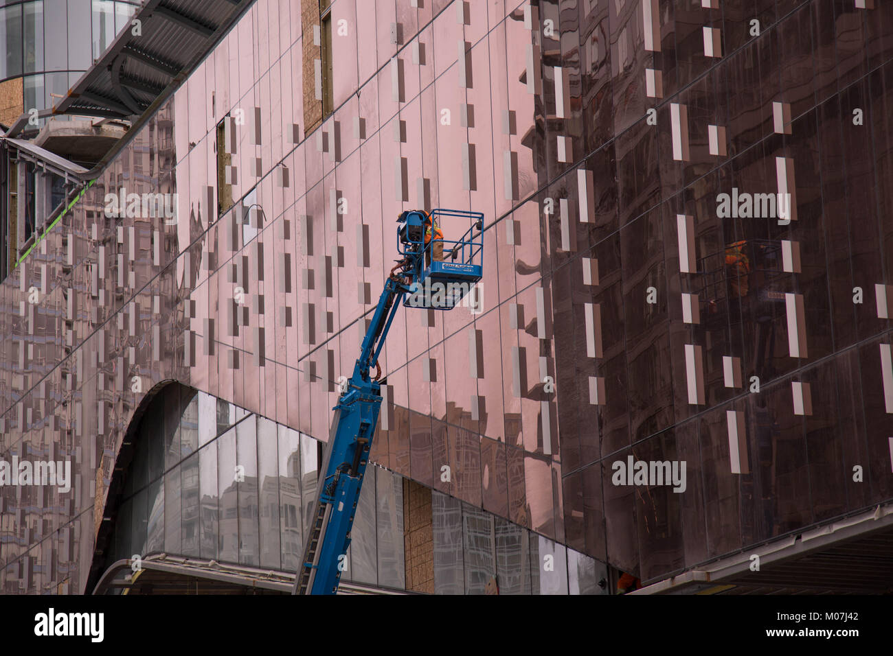 Reflective surface modern building construction Stock Photo - Alamy