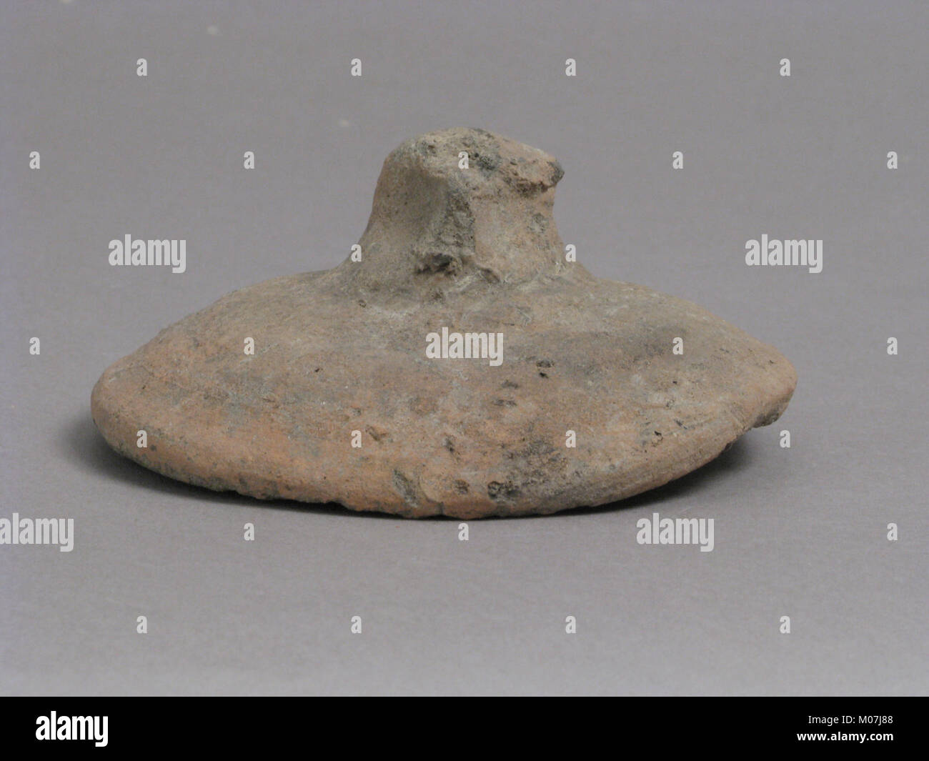 This lid is a beautifully crafted object, likely from a container or ...