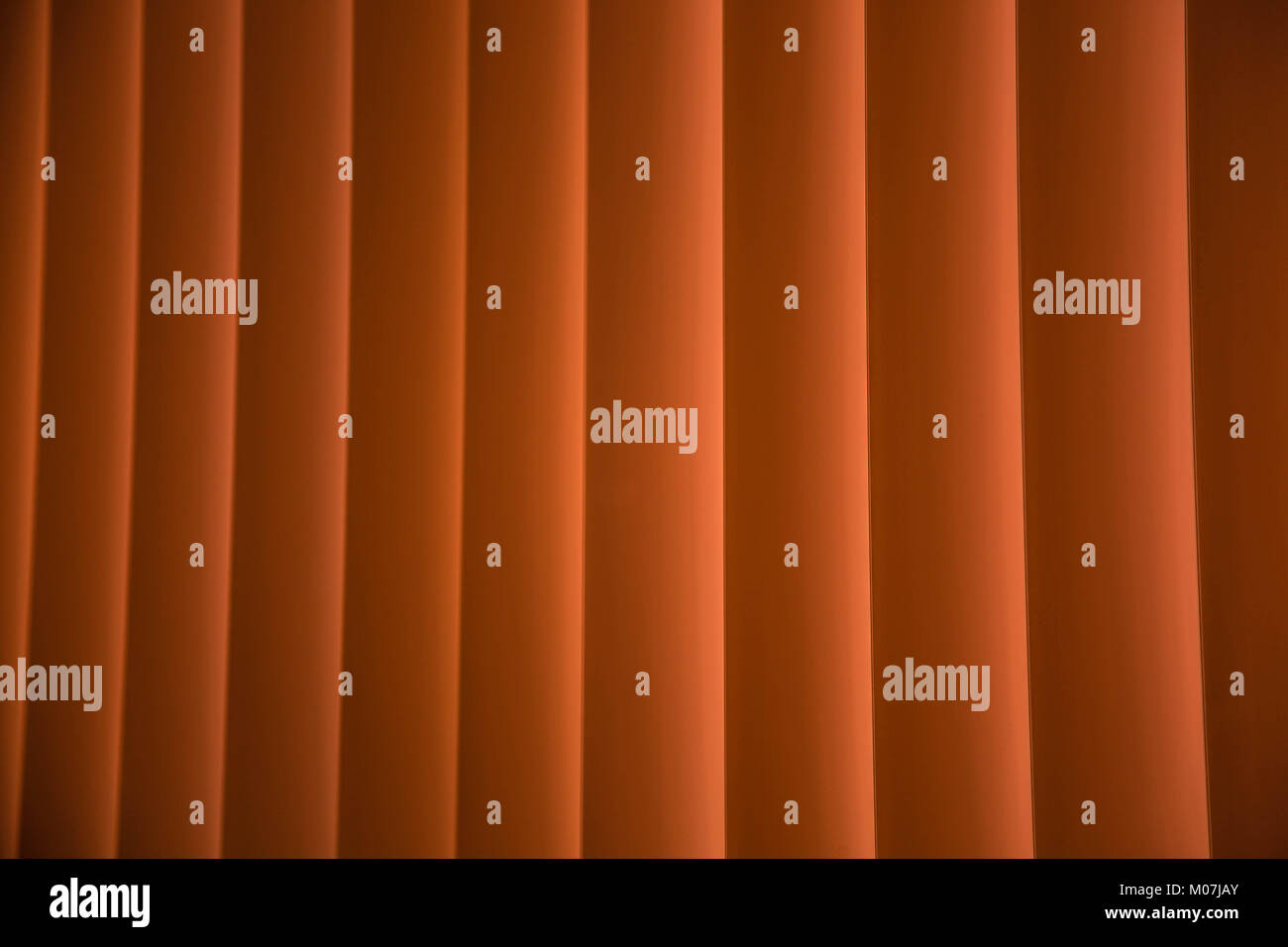 Orange color backdrop shades Stock Photo - Alamy