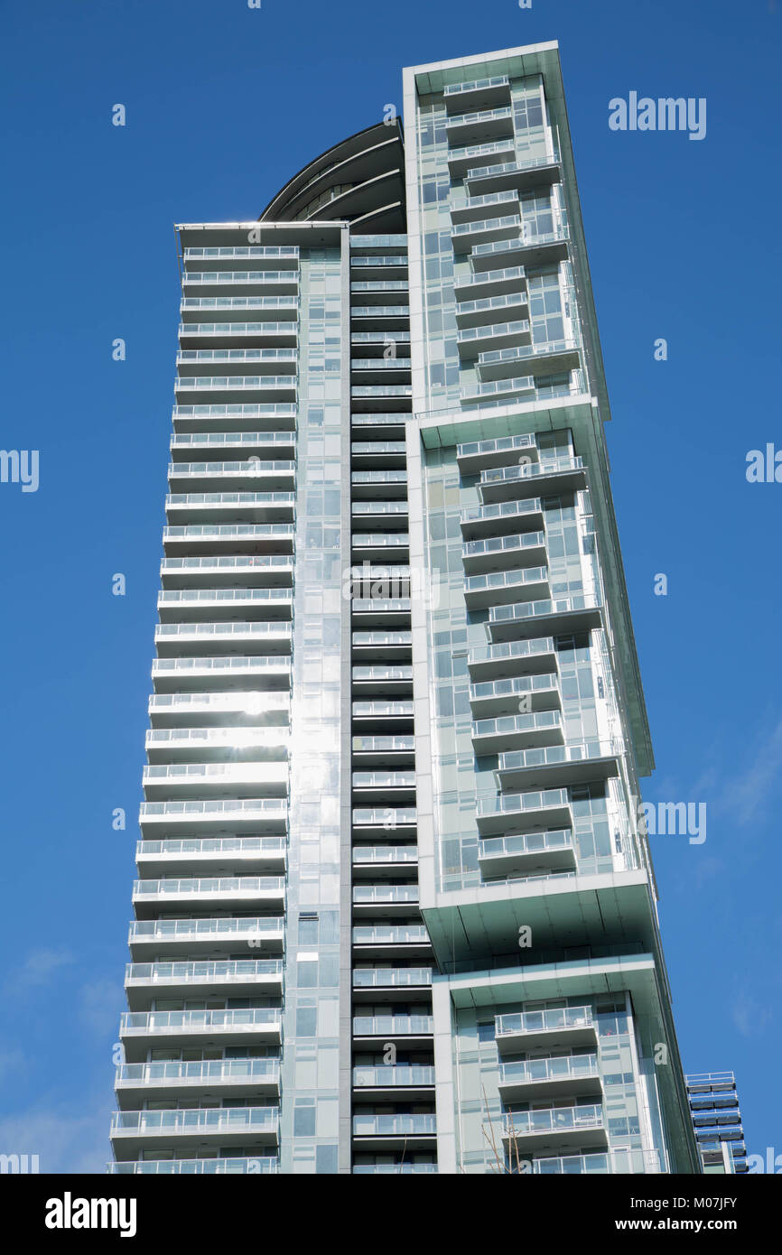 Tall modern building blue sky Stock Photo - Alamy