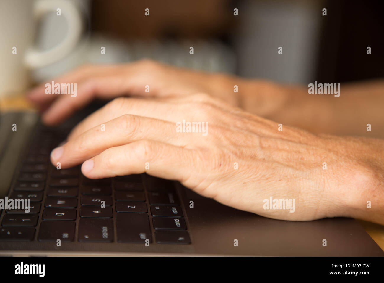 Beautiful hands female typing keyboard Stock Photo - Alamy