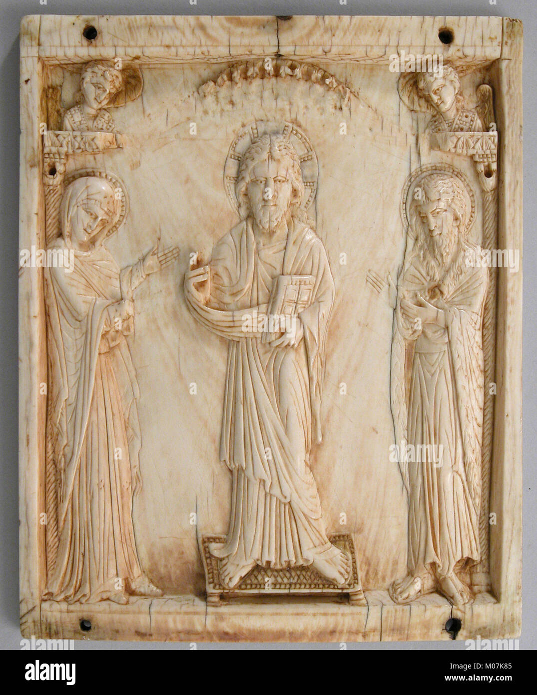 This icon features the Deesis, a traditional Christian iconography ...