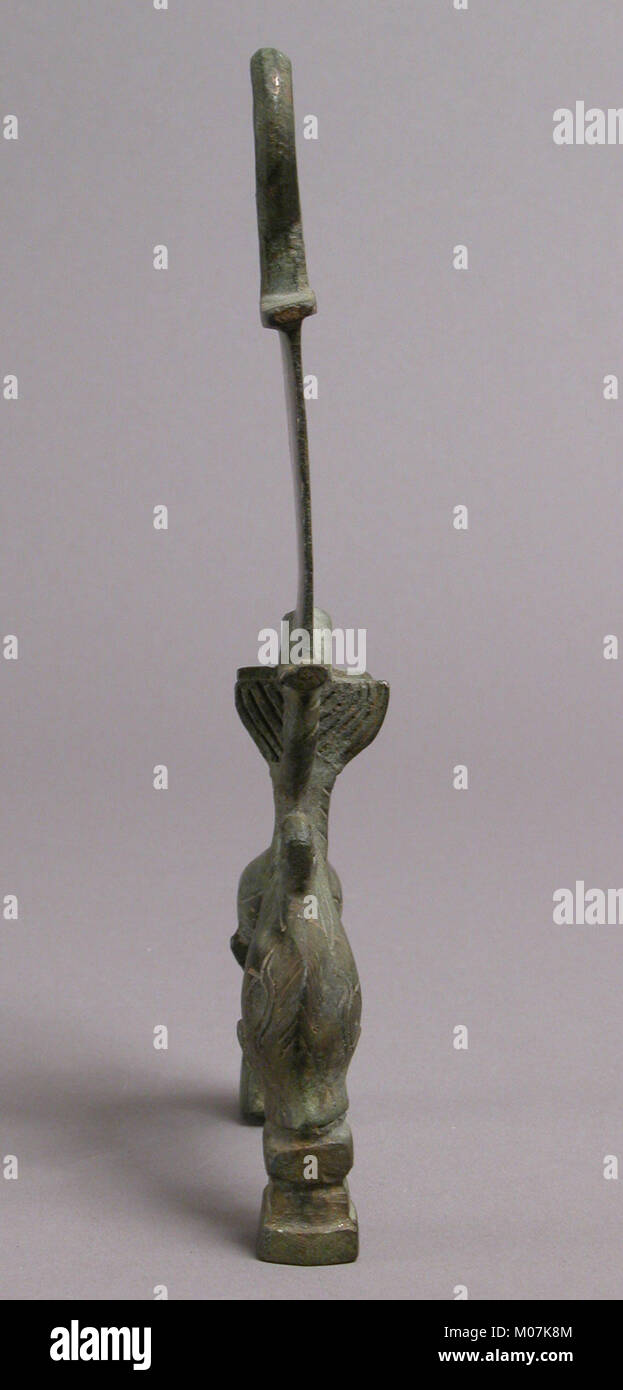 This lamp handle, adorned with dolphins, showcases the artistic design ...