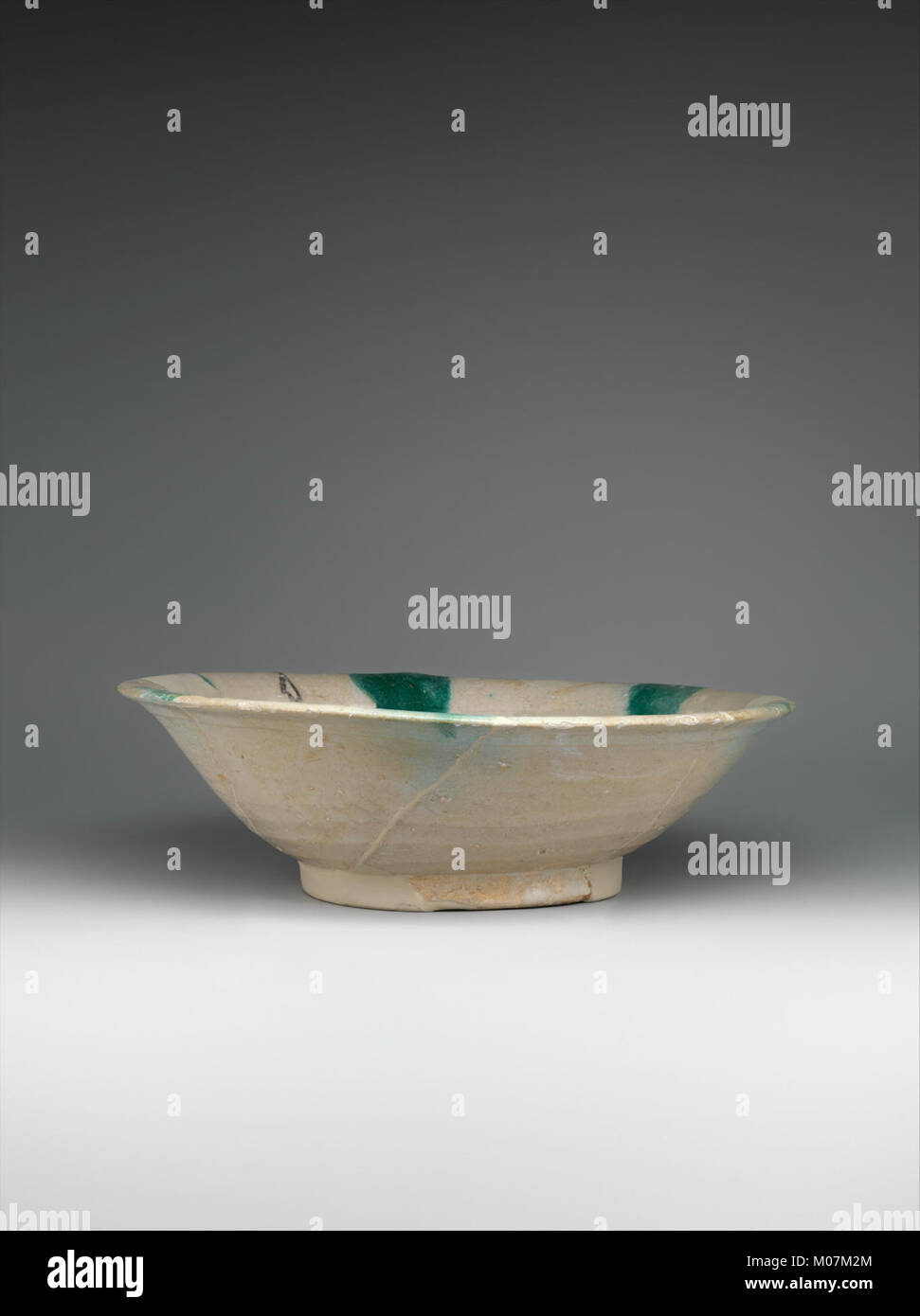 This imitation green-splashed Samarra ware piece reflects the intricate ...