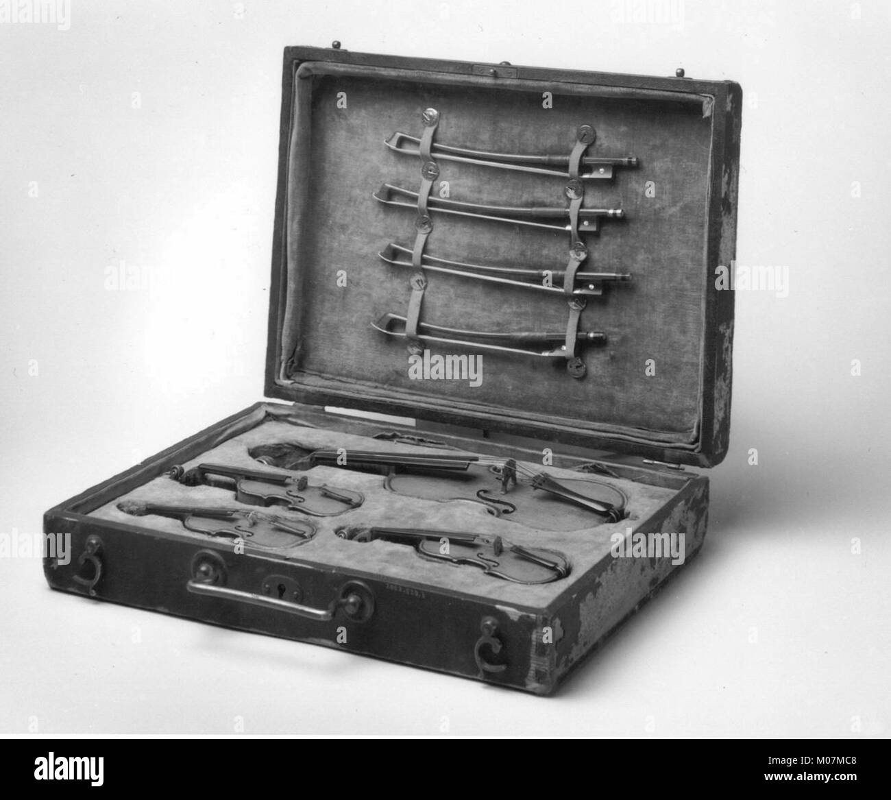 This miniature string quartet case is a finely crafted container ...