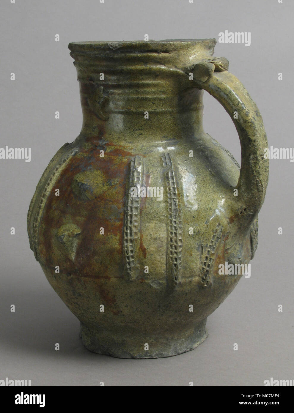 This jug is an example of pottery craftsmanship, often used for daily ...