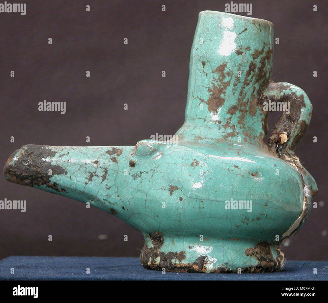 This lamp, a fine example of period lighting design, combines aesthetic ...