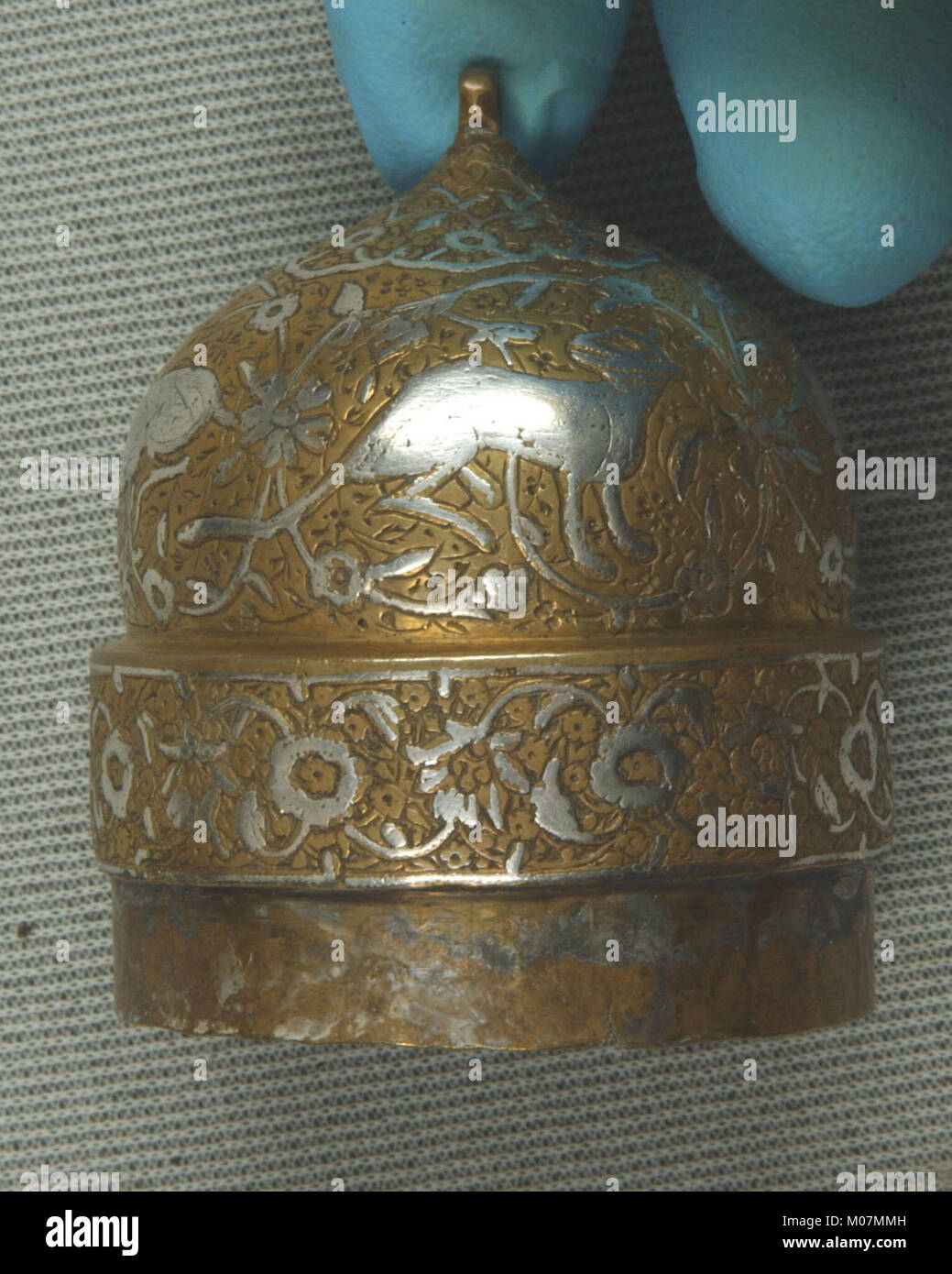 This inkwell features intricate floral and animal imagery, highlighting ...