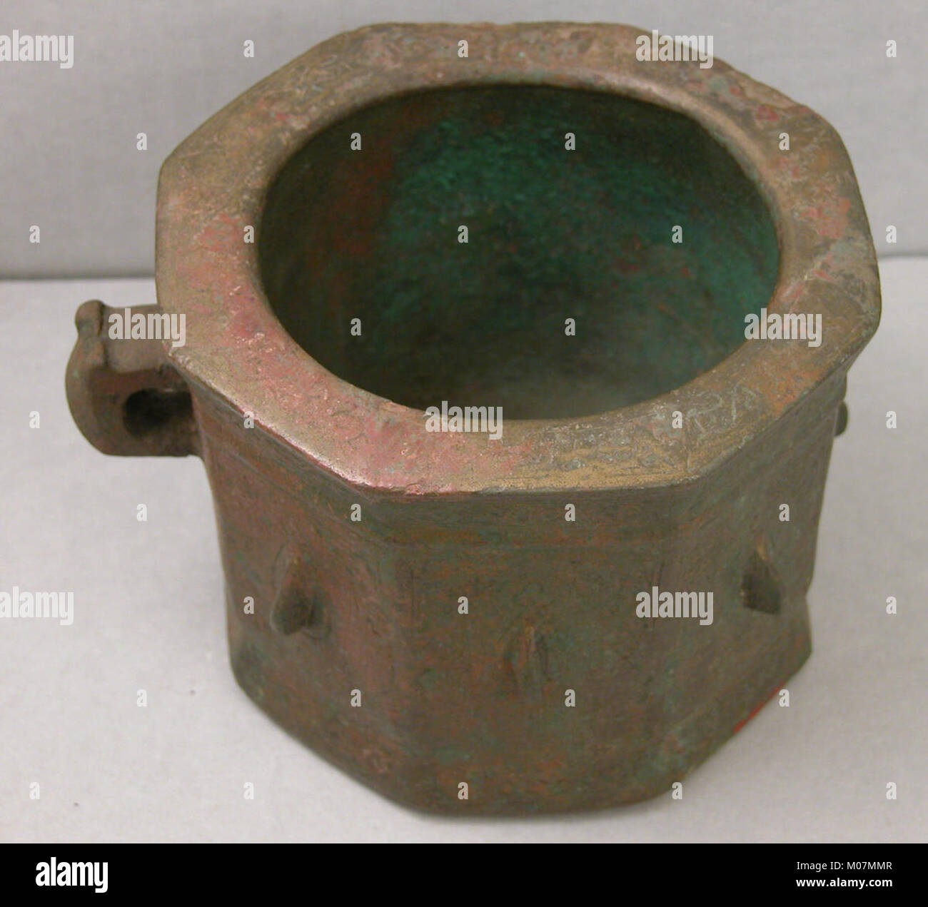 A historical mortar, likely used for grinding and mixing substances ...