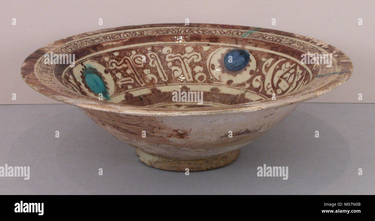 This luster bowl features reflective, metallic decoration, showcasing ...