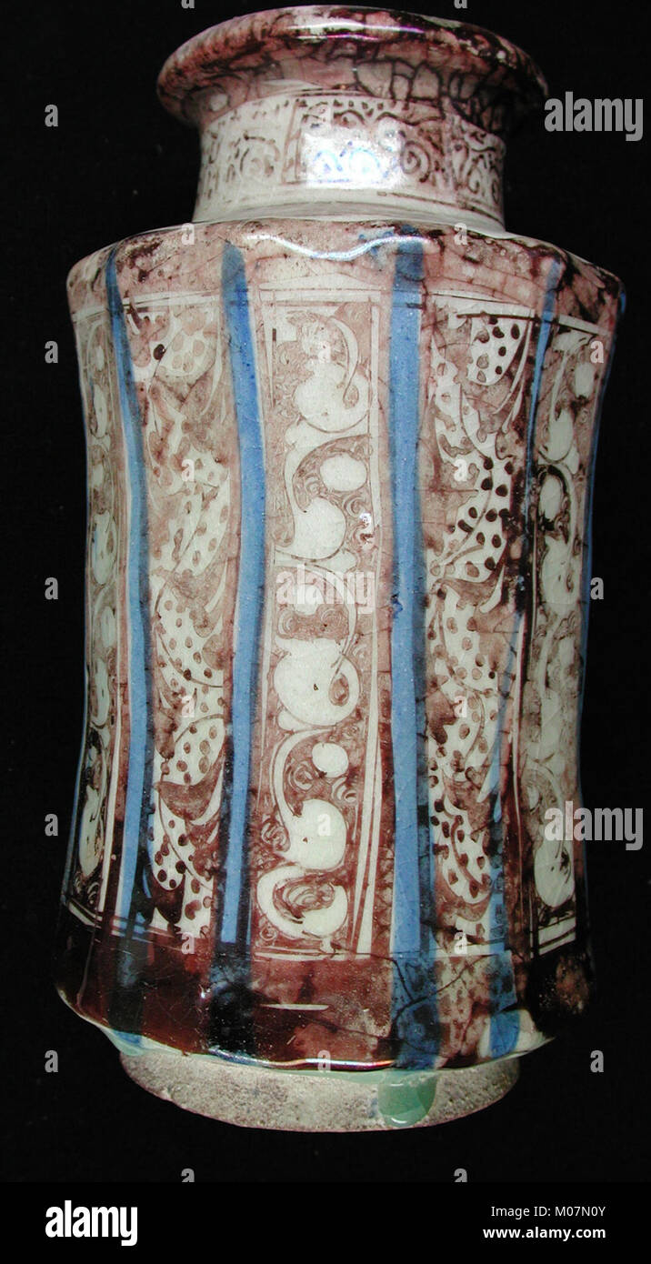 This jar, crafted from ceramic, features decorative elements that ...