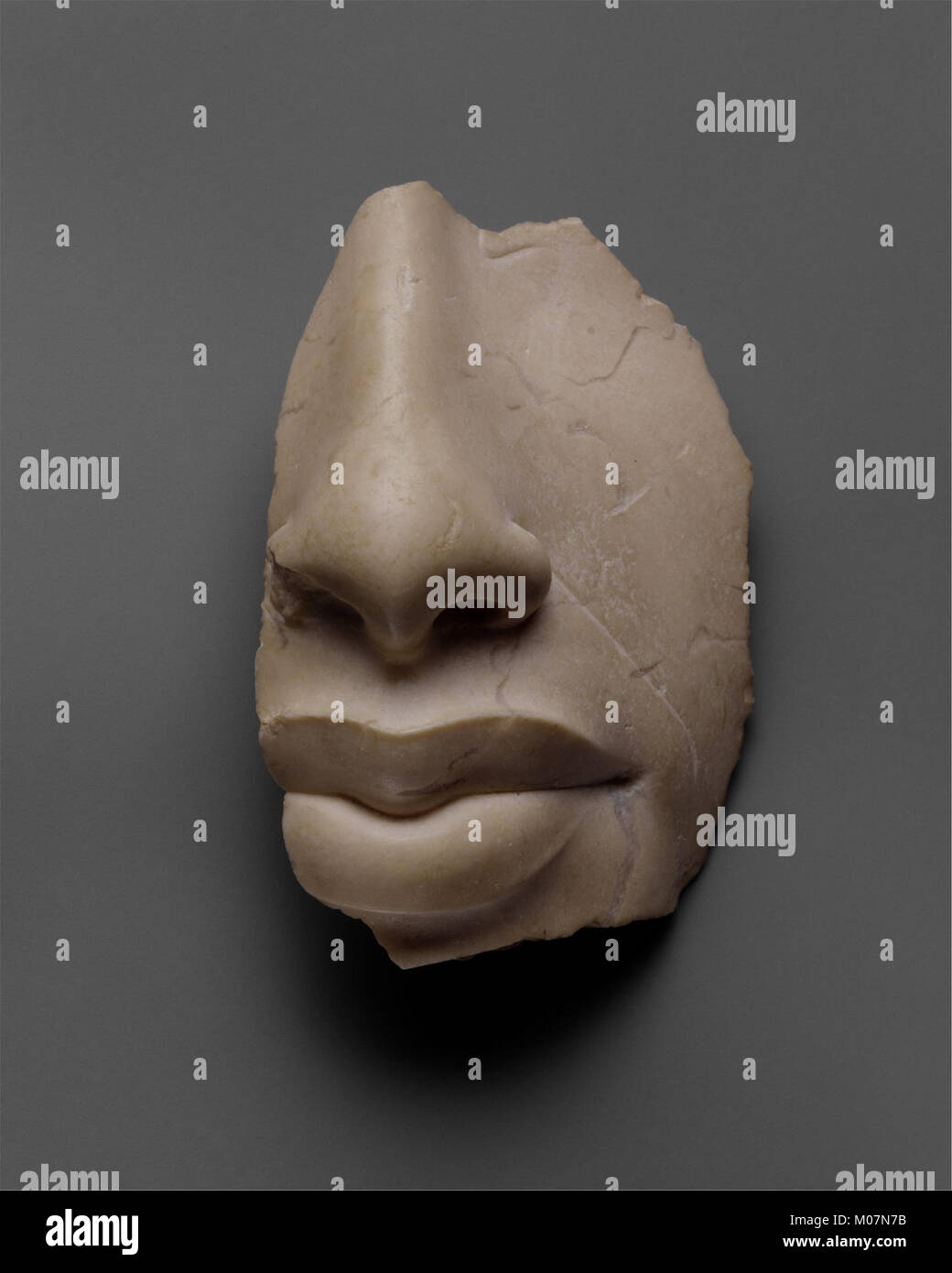 This sculpture fragment features the nose and lips of Akhenaten, an ...