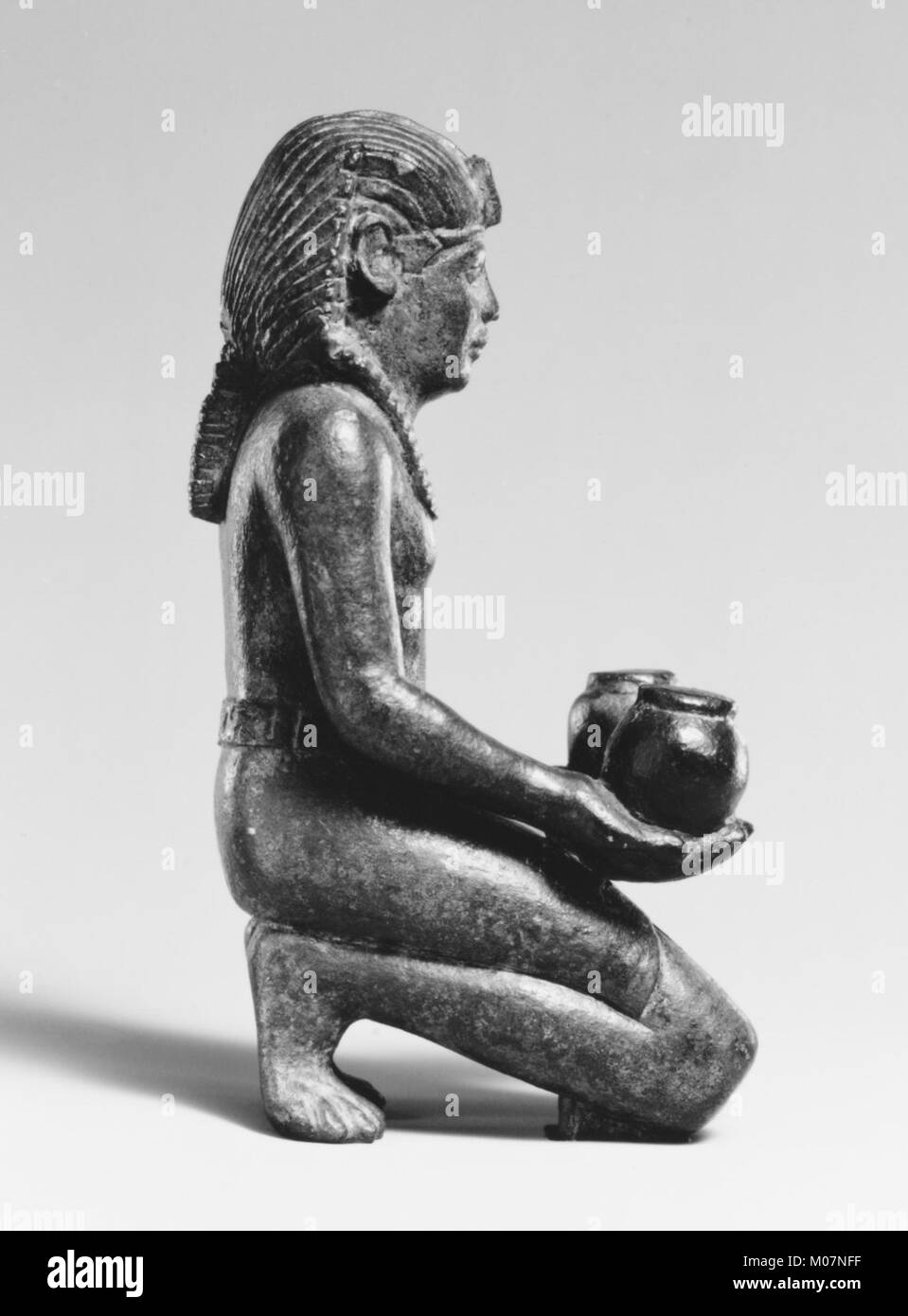 Kneeling statuette of King Amasis MET 267772 Stock Photo - Alamy