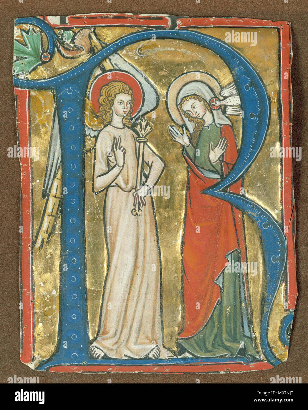 This manuscript illumination depicts the Annunciation scene within an ...