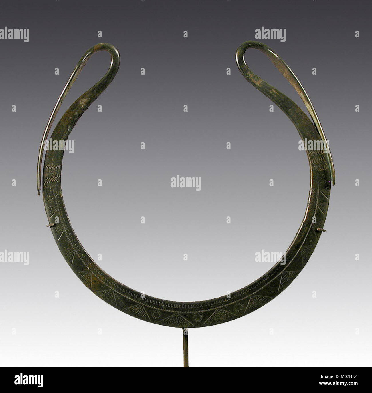 A neck ring, an ornamental piece often worn as jewelry, highlighting ...
